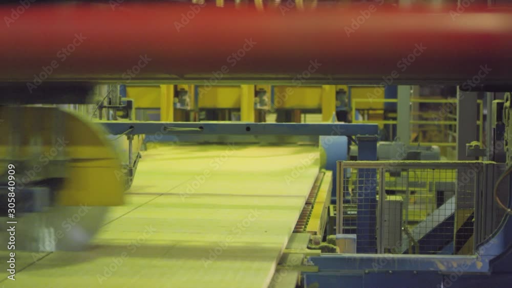 Close-up shot of industrial machine with large metal cutter wheel ...