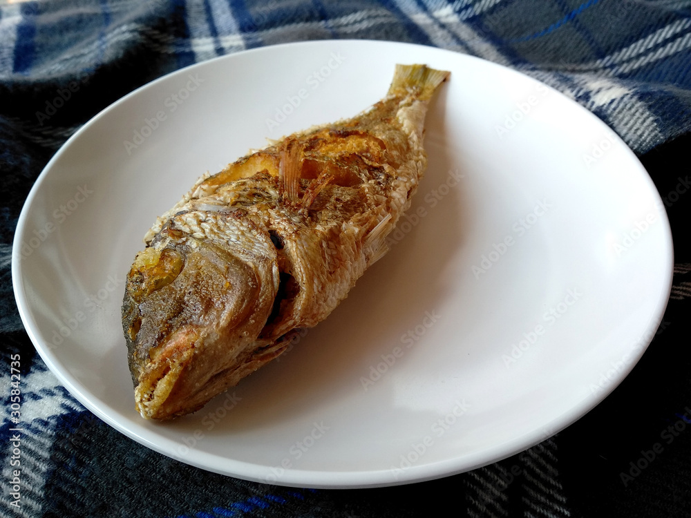 Traditional indonesian culinary food. Ikan Goreng or fried fish. Ikan ...