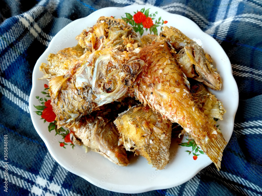 Traditional indonesian culinary food. Ikan Goreng or fried fish. Ikan ...