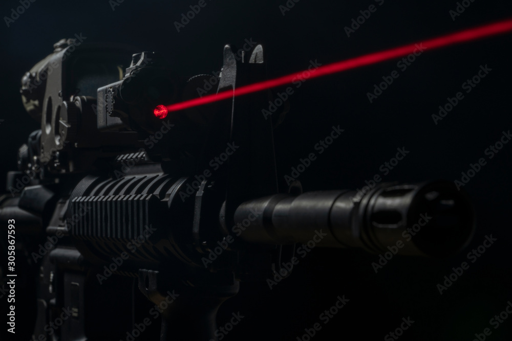 Optical sight and laser device with a red beam on the M4 rifle Stock ...