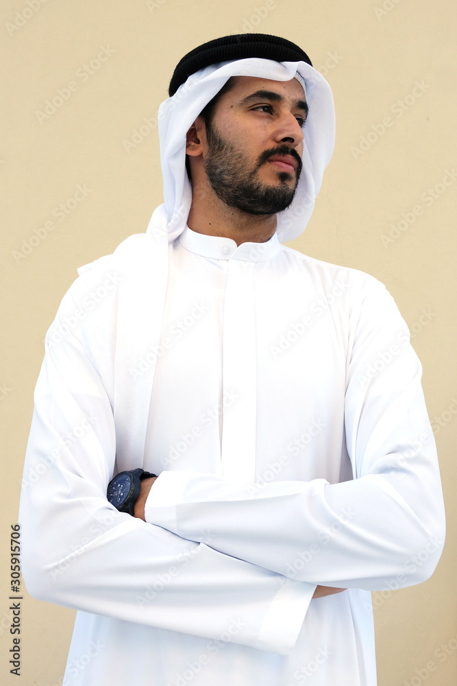 Arab man wearing Emirati Kandoora. Modern Arabic MIddle Eastern man ...