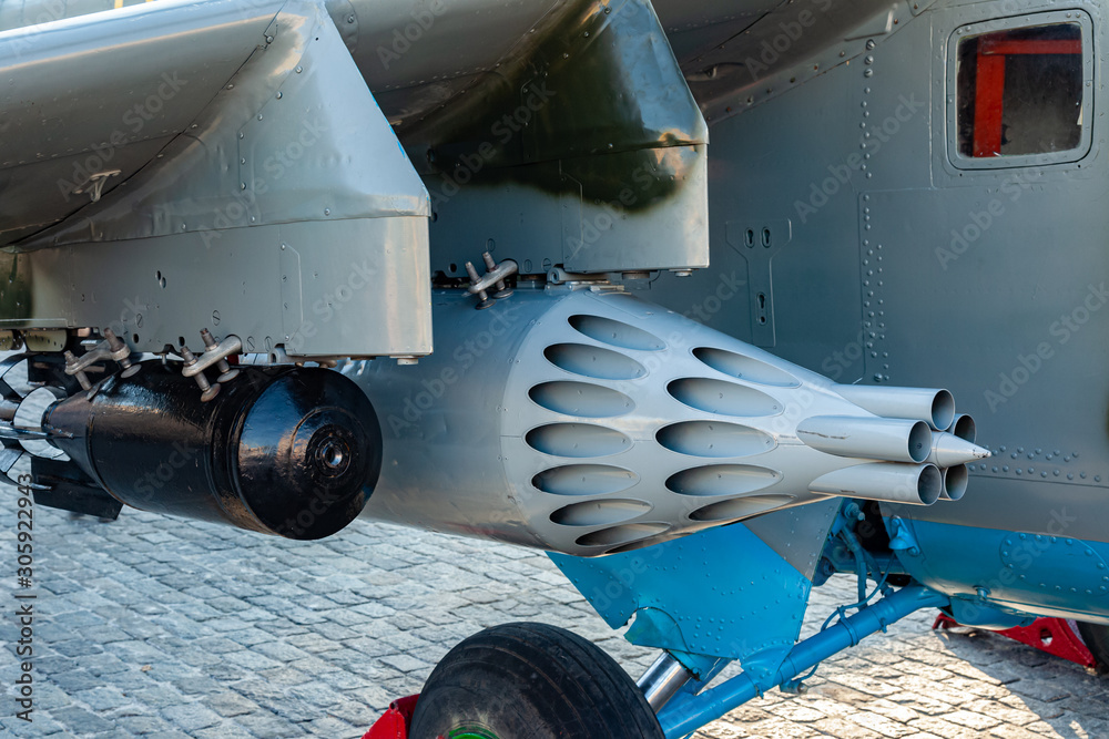 Air bomb suspended under the wing of an aircraft. Rocket pod with empty ...