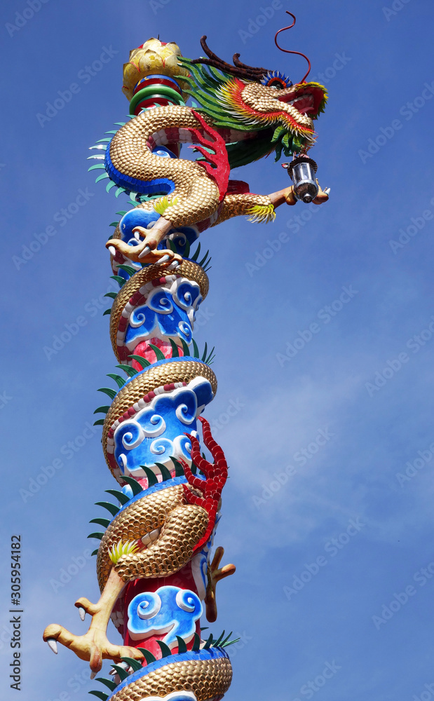 Colorful Chinese dragon pole with clear blue sky background Stock Photo ...