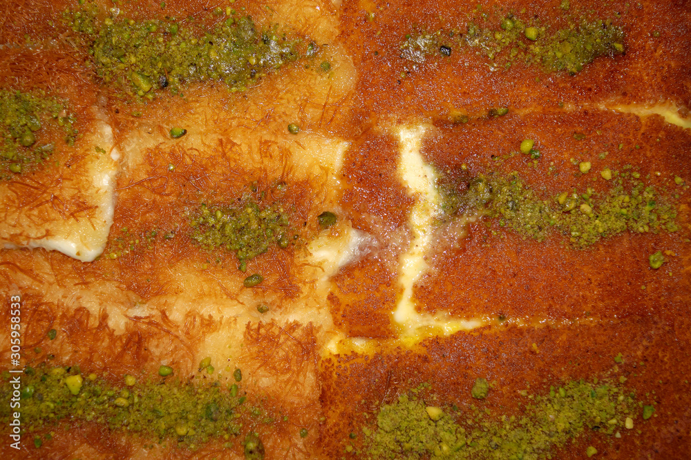 Traditional eastern dessert kunafa. Top view of arabic mixed cheese ...