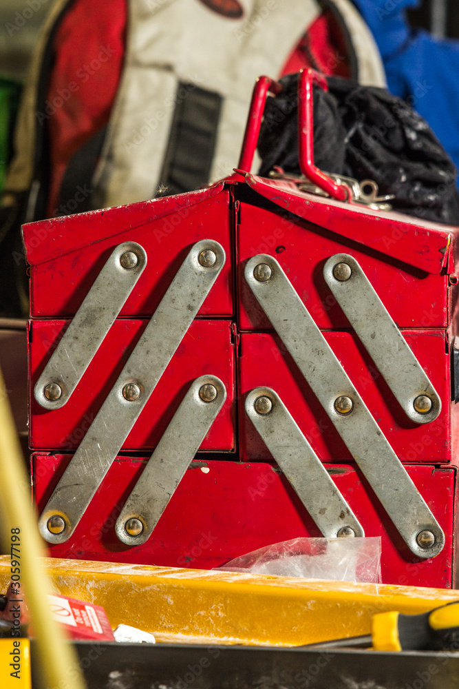 Photographic image of a red tool box in a factory setting nice and ...