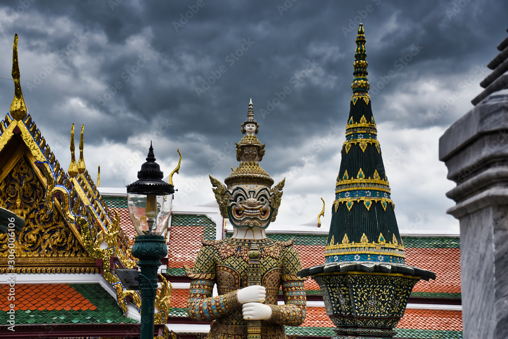 Giant Yak, Yaksha statue with large teeth, piercing eye with sword in ...