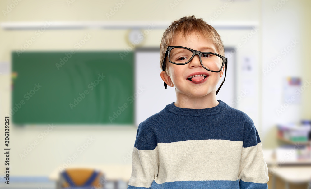 school, education and vision concept - portrait of smiling little boy ...