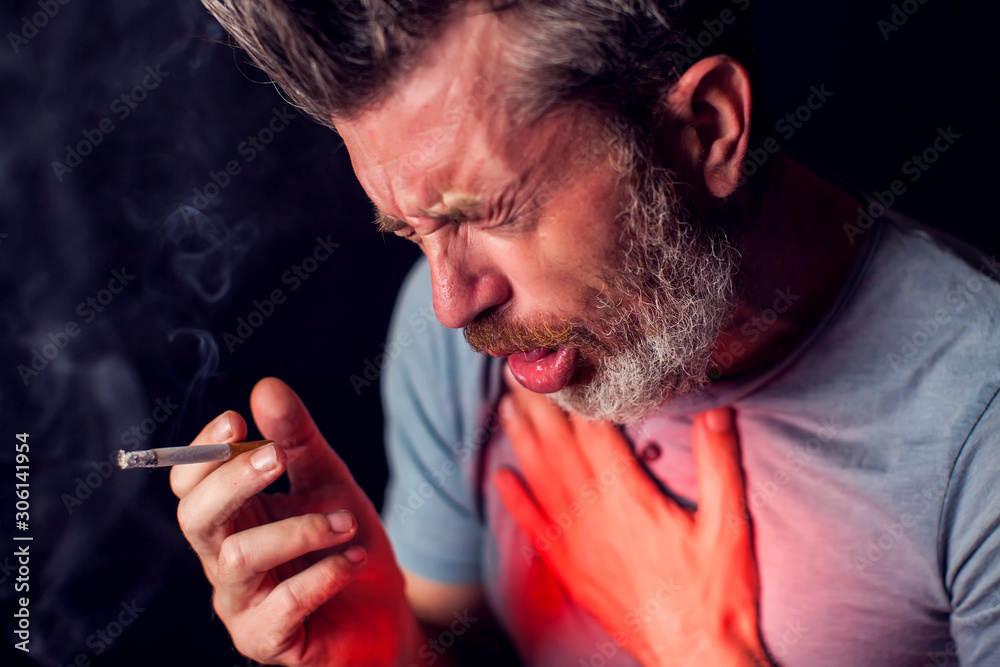 Man smokes cigarette and has problem with lungs. Cigarette addiction ...