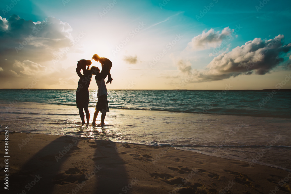 happy family with kids on play on sunset beach Stock Photo | Adobe Stock