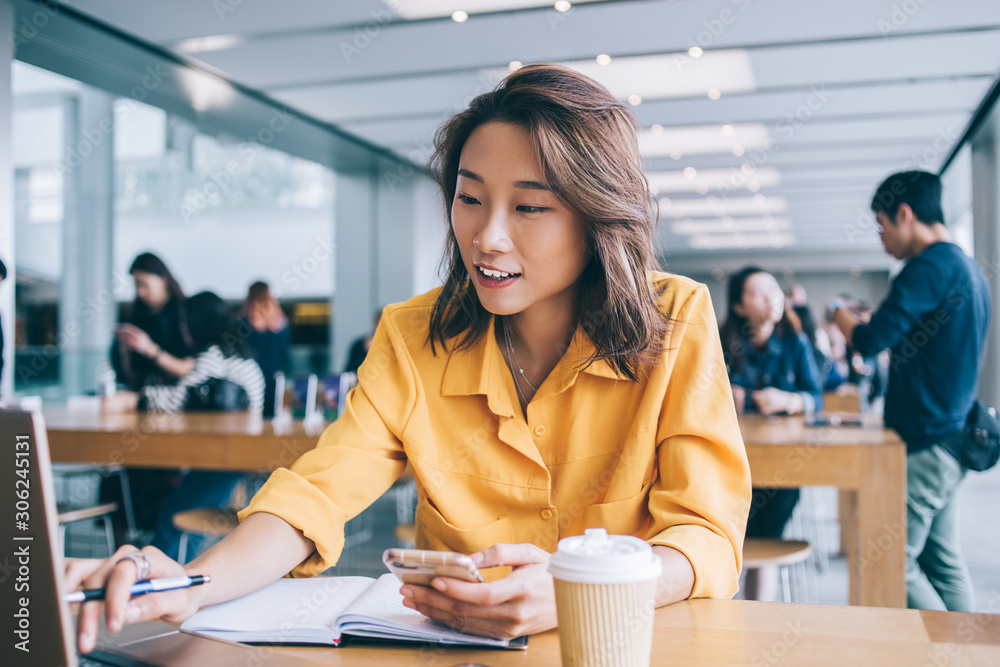 Attractive Chinese student sharing media files for presentation between ...