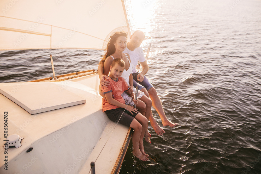 Happy family sailing on a luxury yacht or catamaran boat Stock Photo ...