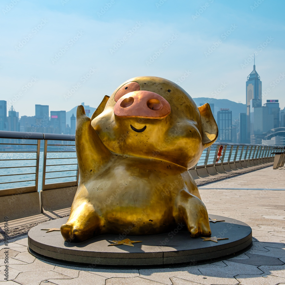 A bronze sculpture of McDull, an anthropomorphic pig cartoon character ...