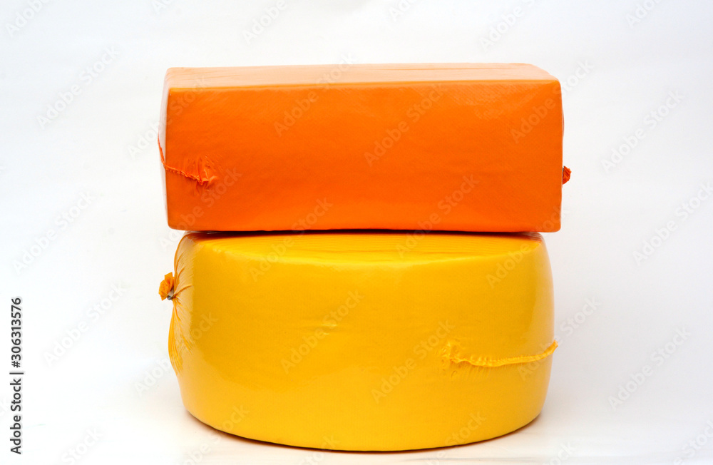 Big cheese head, cheese wheel in yellow vacuum package. Cheese block ...