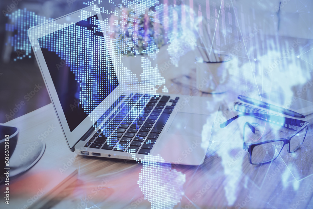 Stock market graph on background with desk and personal computer. Multi ...