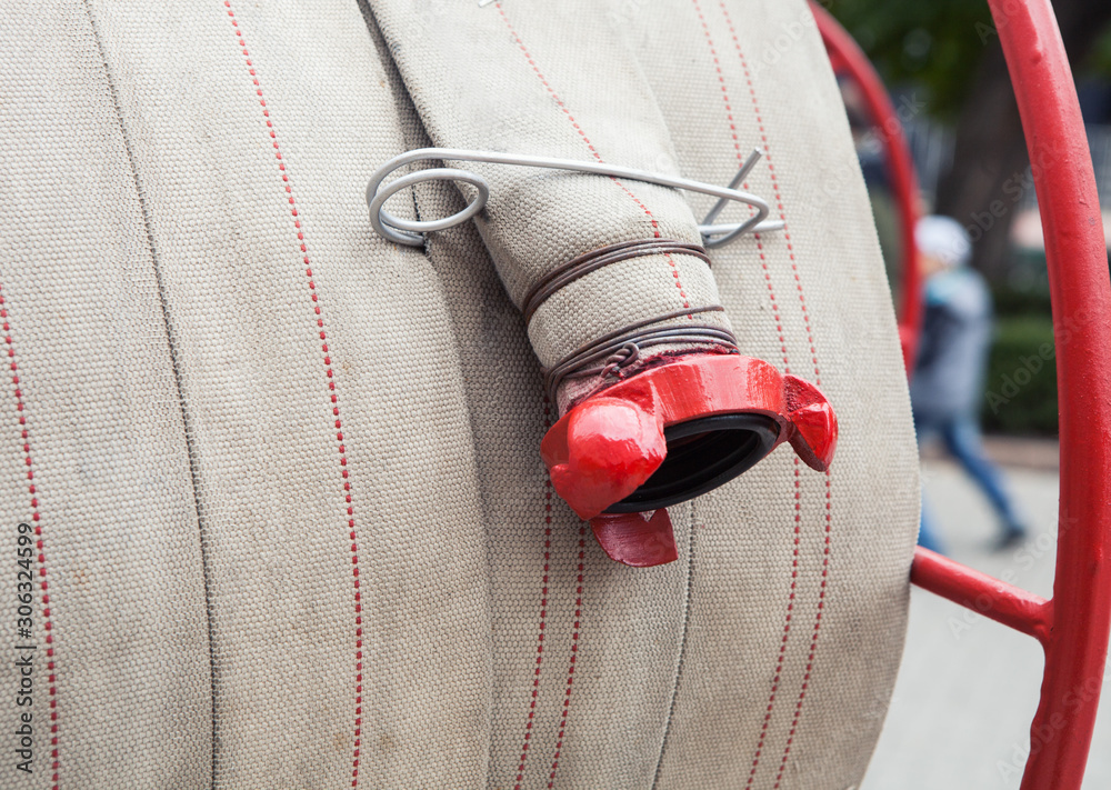Fire hose on the reel of an old fire truck. Stock Photo | Adobe Stock