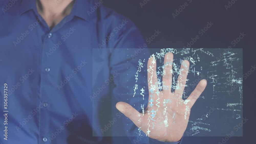 A person touches a futuristic screen with his hand on which a digital ...