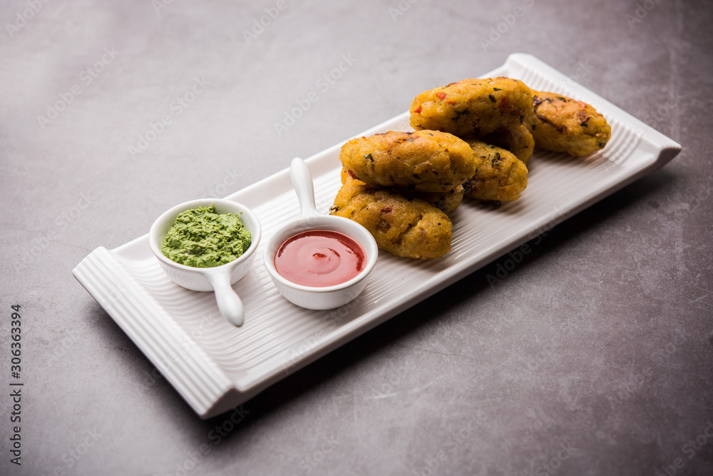 Veg Poha Roll made using flattened Rice, served with tomato ketchup and ...