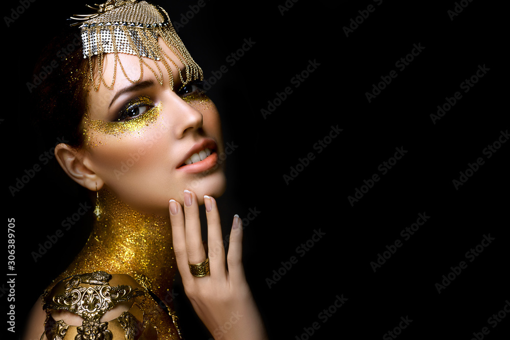 Beautiful woman portrait with golden glitter on her face. Girl with art ...