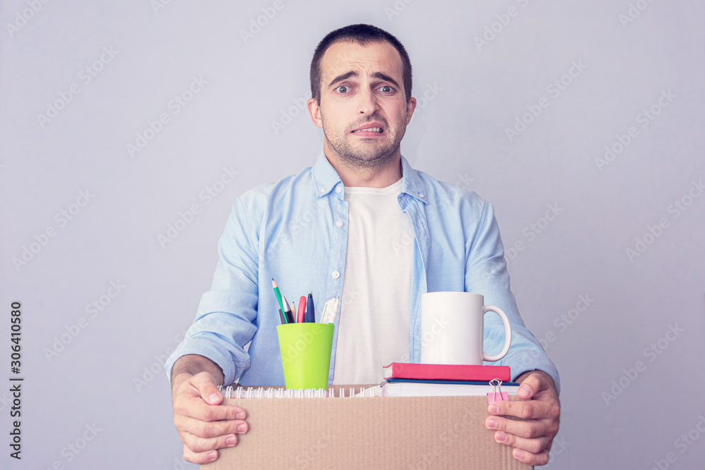 Concept of dismissal from work. Young employee was fired from his job ...