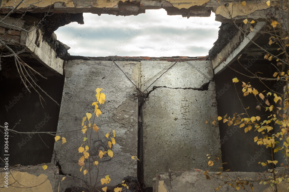 Collapsed roof concrete floor of abandoned building. Through hole in ...