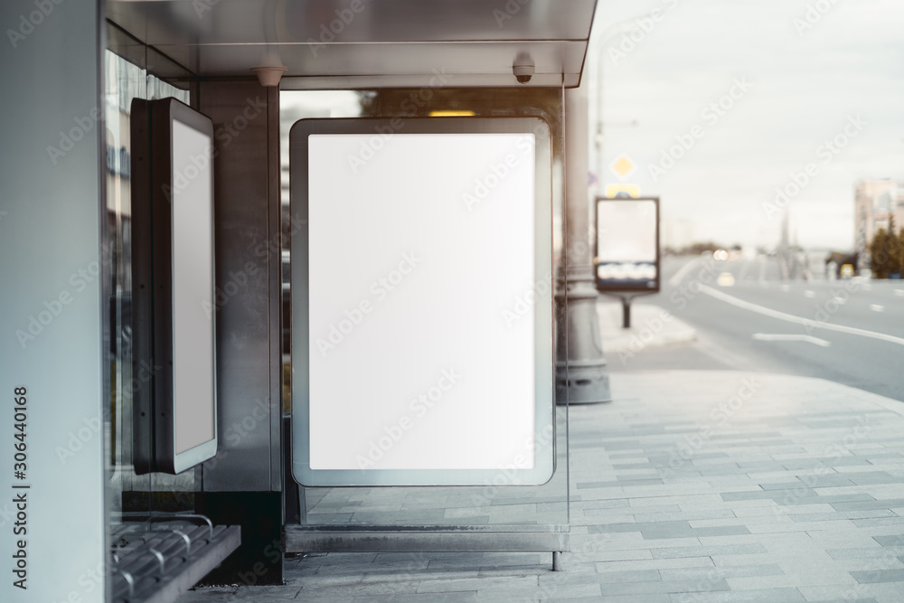City bus stop on with an empty banner mockup; template of advertising ...