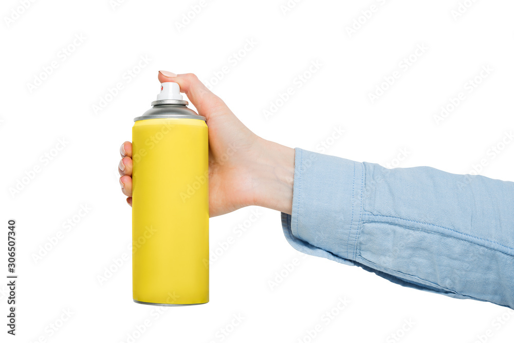 Yellow spray can for spraying in a female hand. No inscriptions. White ...
