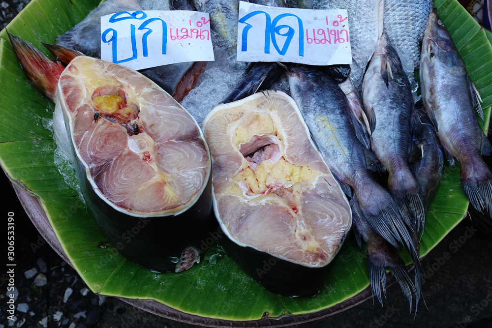 Pressed fish, giant catfish, sliced in the rural market. (English ...