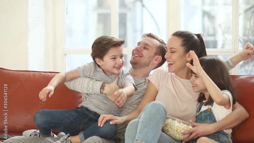 Excited family football fans watching sport tv game celebrating goal ...