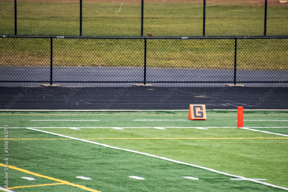 Fotografia do Stock: View of orange goal markers on American football ...