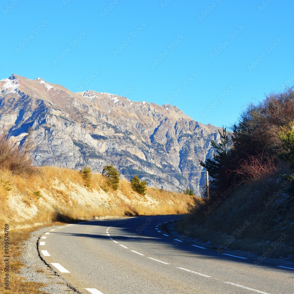 Mountain road with a sharp turn high in french Alps mountains. Ecrins ...