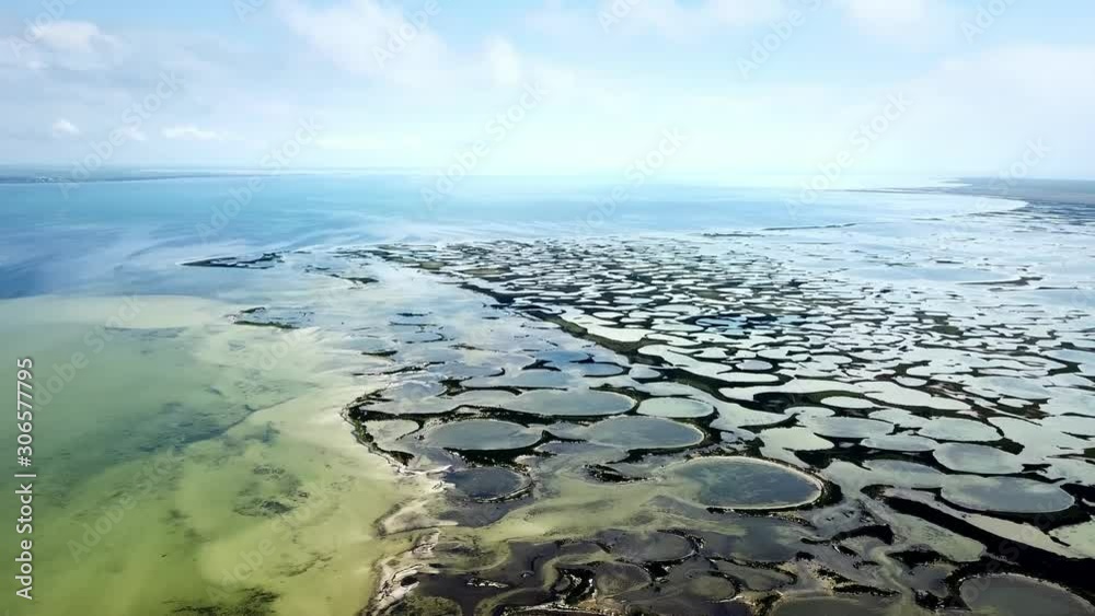 many circle lakes on the Dzharylgach island, part of shallow land with ...