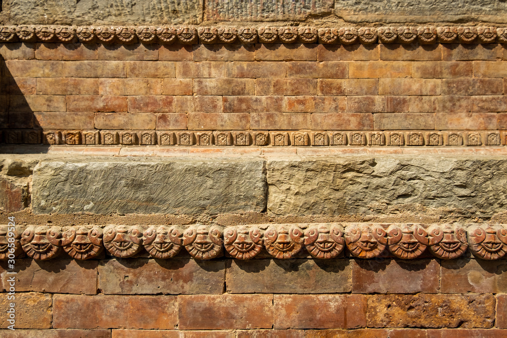 Graceful ancient stone carving. Brown stone texture. Wall of an old ...