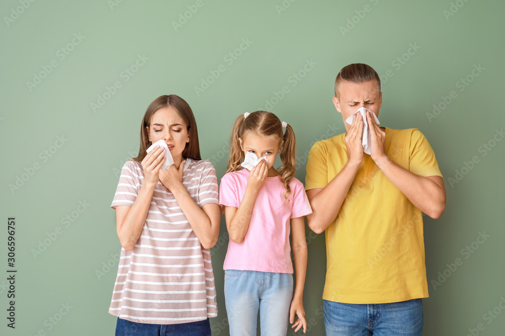 Family suffering from allergy on color background Stock Photo | Adobe Stock