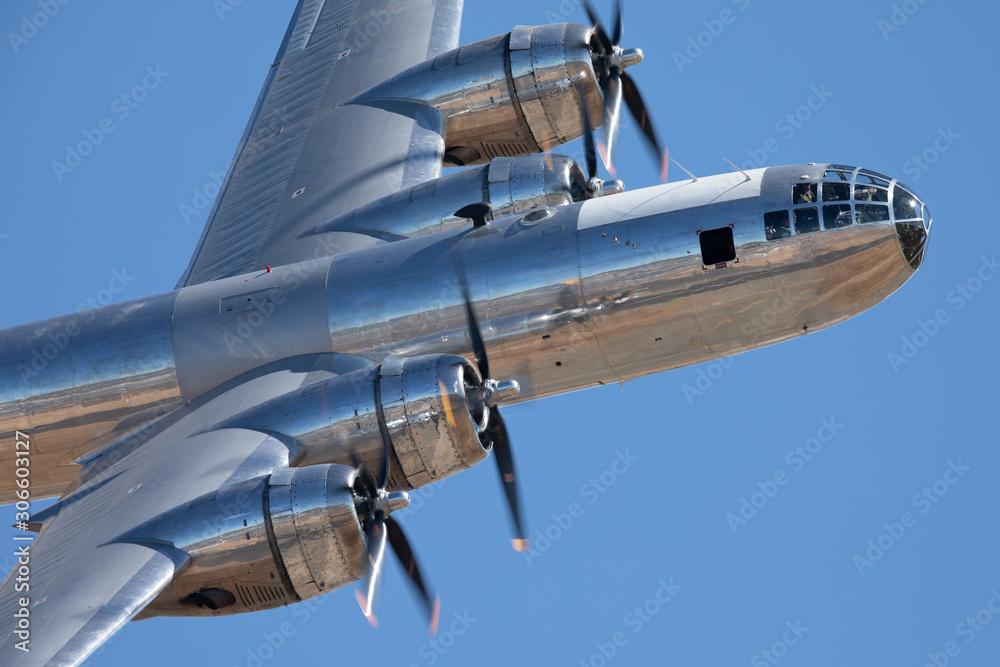 Very close side view of a rare WWII bomber (B-29 Superfortress) flying ...