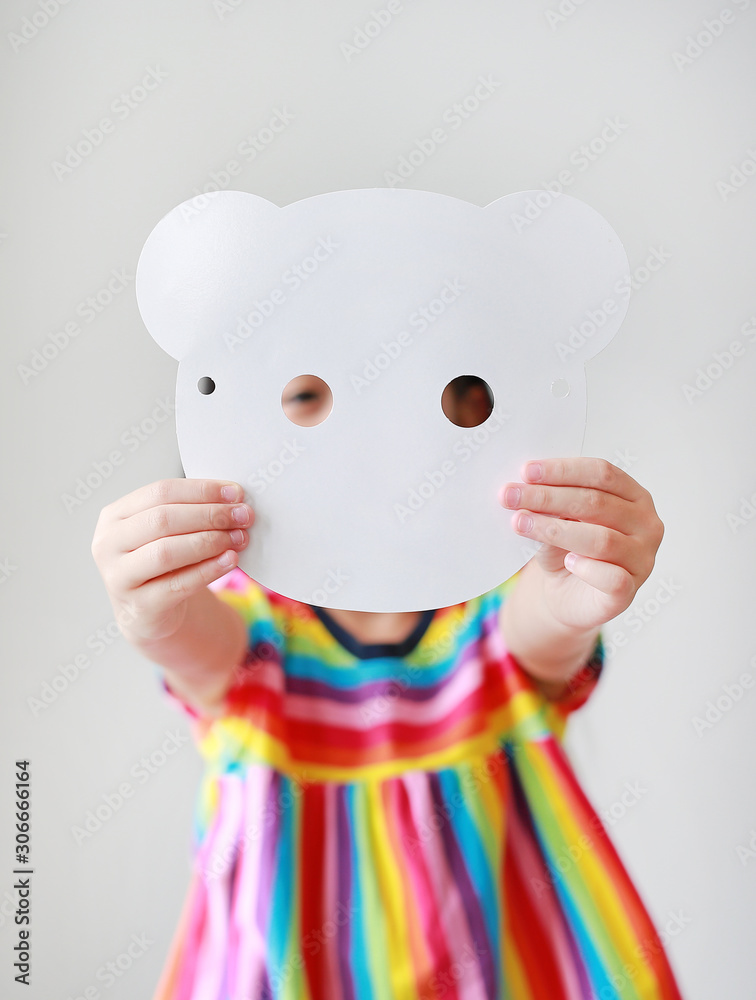 Cute little child girl showing blank white animal paper mask fronting ...