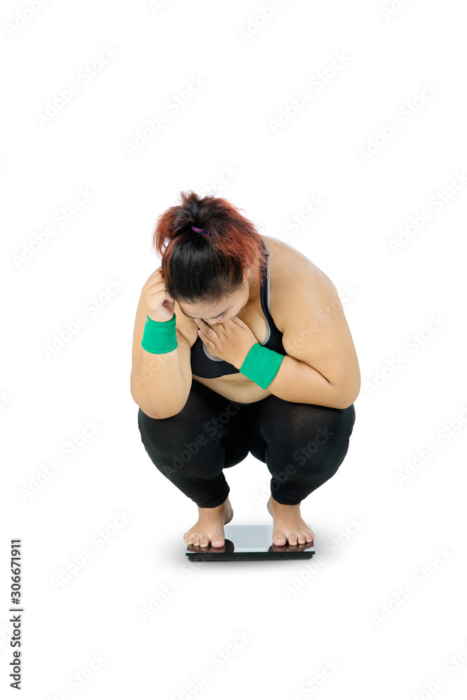 Fat woman crying after seeing her body weight Stock Photo | Adobe Stock