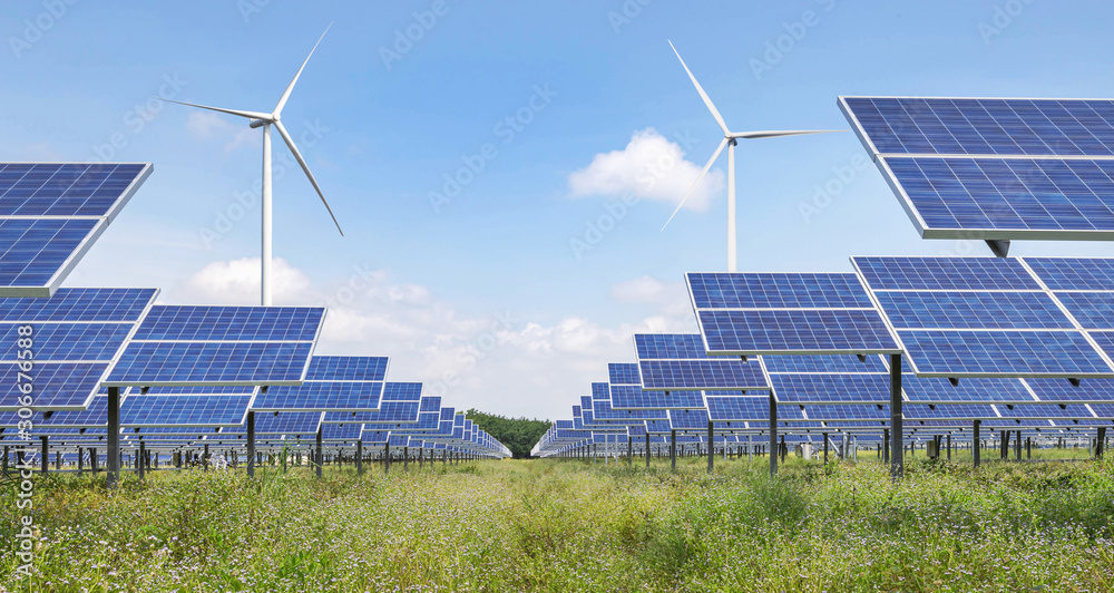 Solar panels and wind turbines generating electricity is solar energy ...