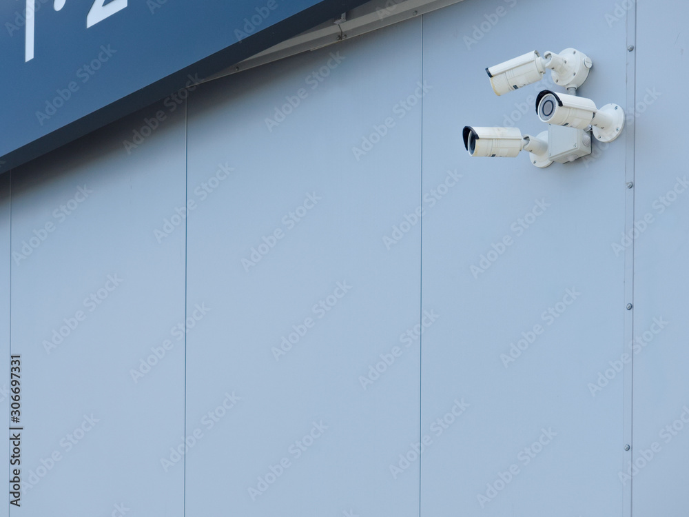 CCTV cameras are installed along on the wall of the building To check ...
