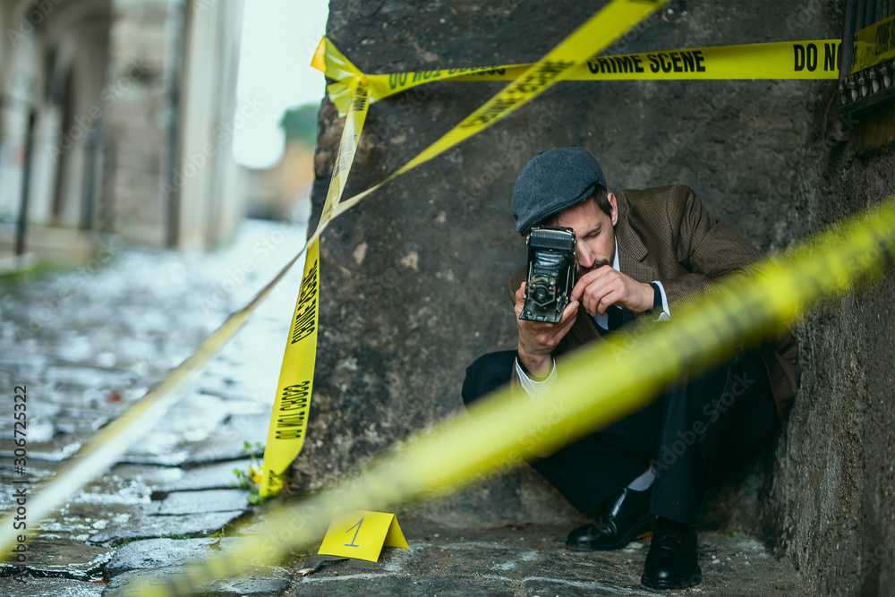 Vintage detective photographating the crime scene Stock Photo | Adobe Stock
