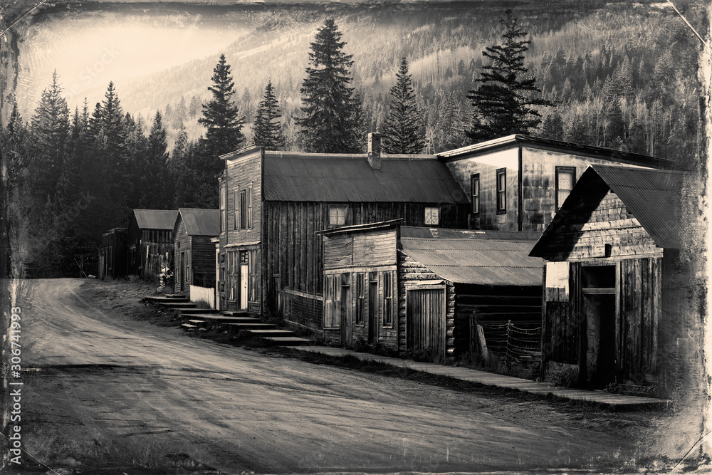 Vintage photo of old western buildings in the middle of mountains Stock ...