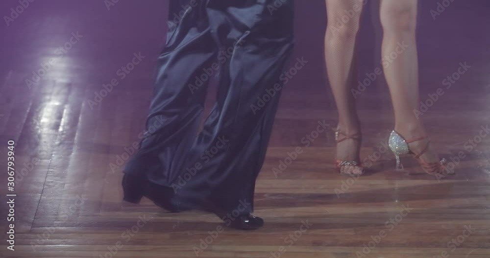 Man legs making clumsy movements trying to dance with woman in huge ...