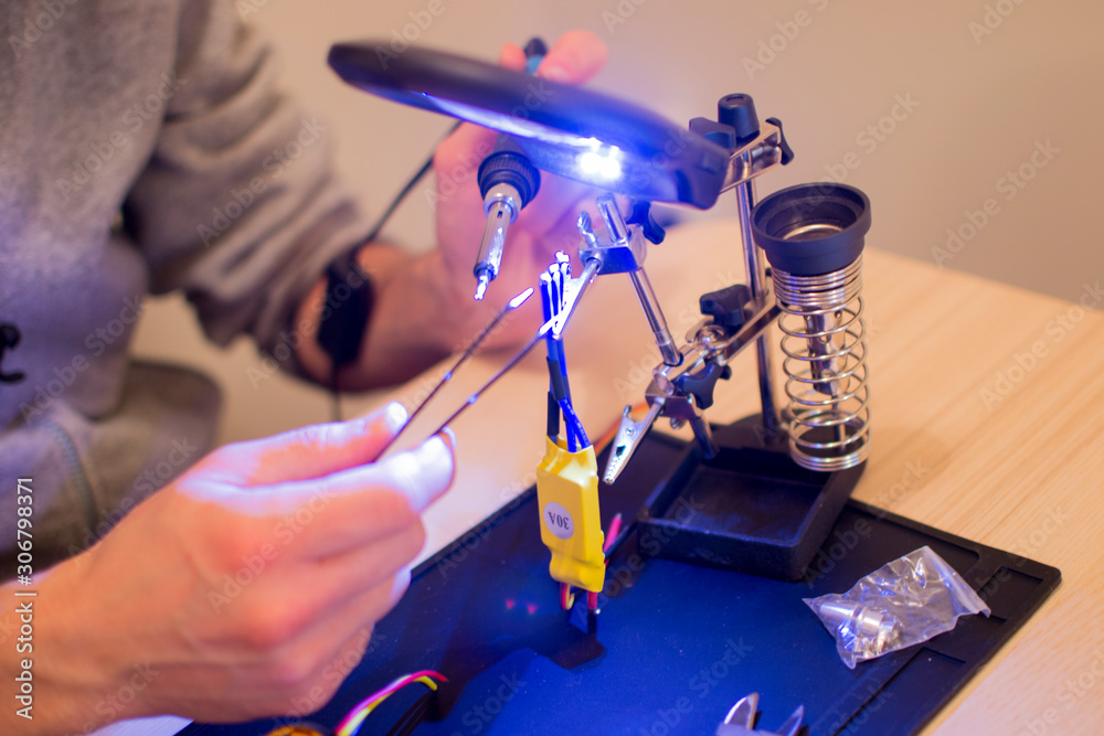 Smoke appears while soldering ESC and rotor wires with helper hands ...