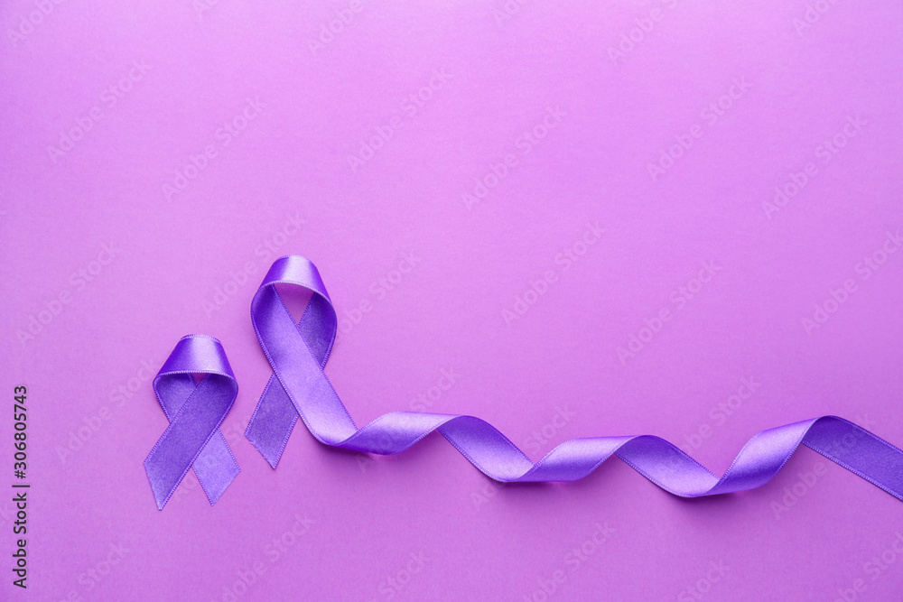 Purple ribbons as symbol of World Cancer Day on color background Stock ...
