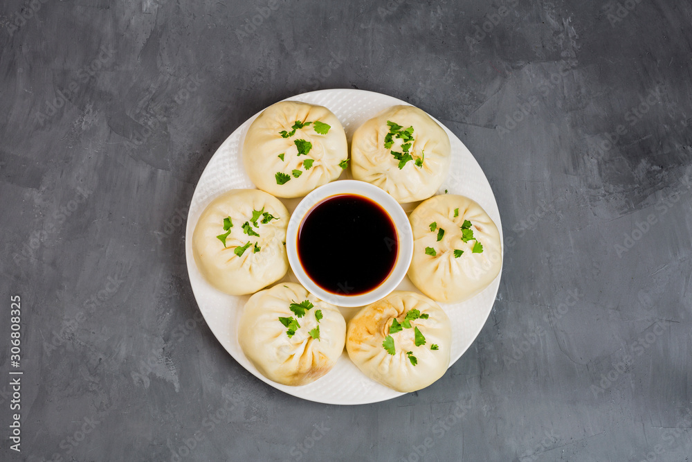 Close up of Chinese steamed dumplings on gray concrete background. Flat ...