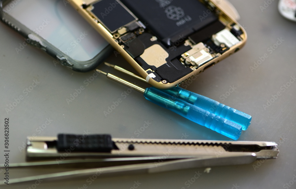 technician repairing broken mobile phone close-up.Close-up Of A Human ...