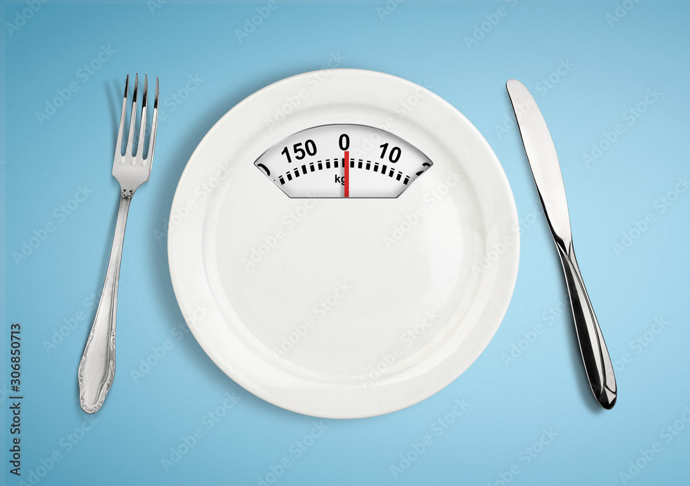 Diet and weight loss concept. Plate with scale weighing-machine Stock ...