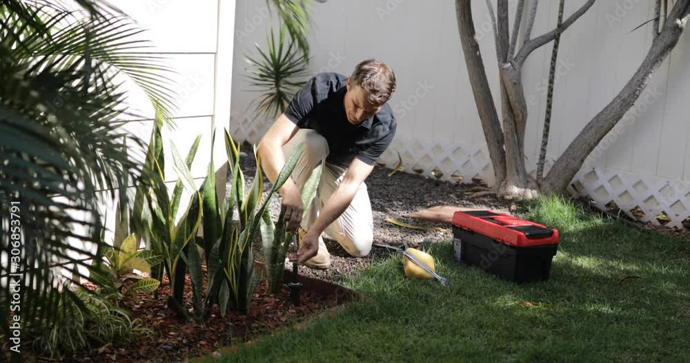 Grass Field Sprinklers Installation by Professional Caucasian Garden ...