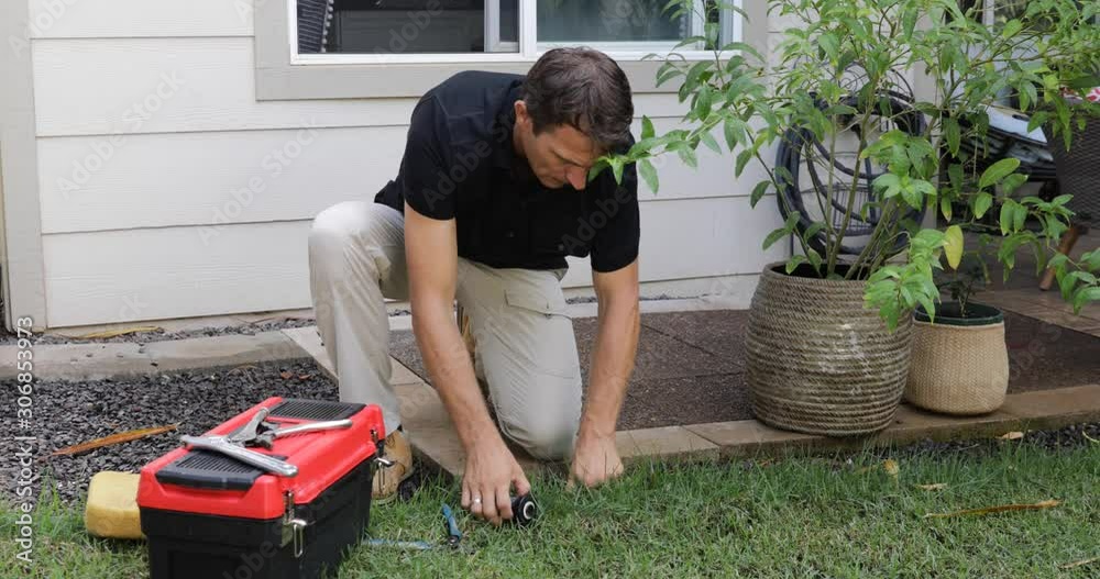 Grass Field Sprinklers Installation by Professional Caucasian Garden ...