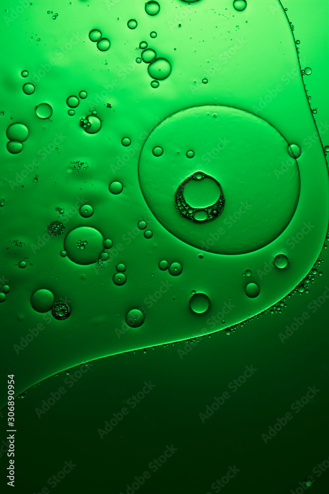 abstract green cells under microscope, biology science backgropund ...