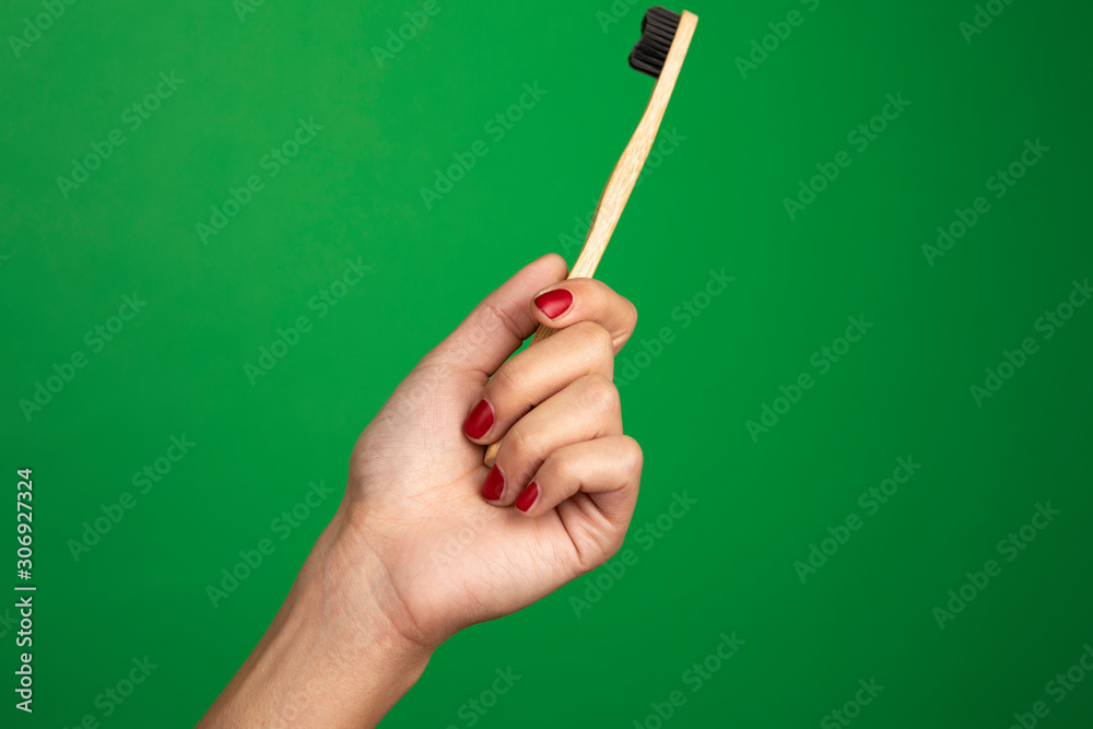 tooth brush in hand Stock Photo | Adobe Stock